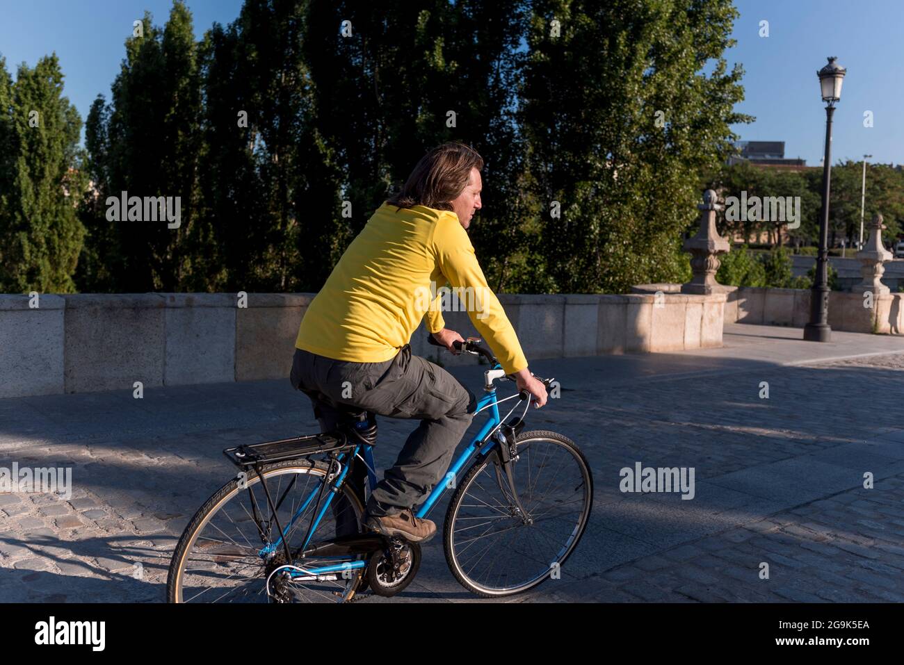 Caucasian male riding bicycle hi-res stock photography and images - Alamy