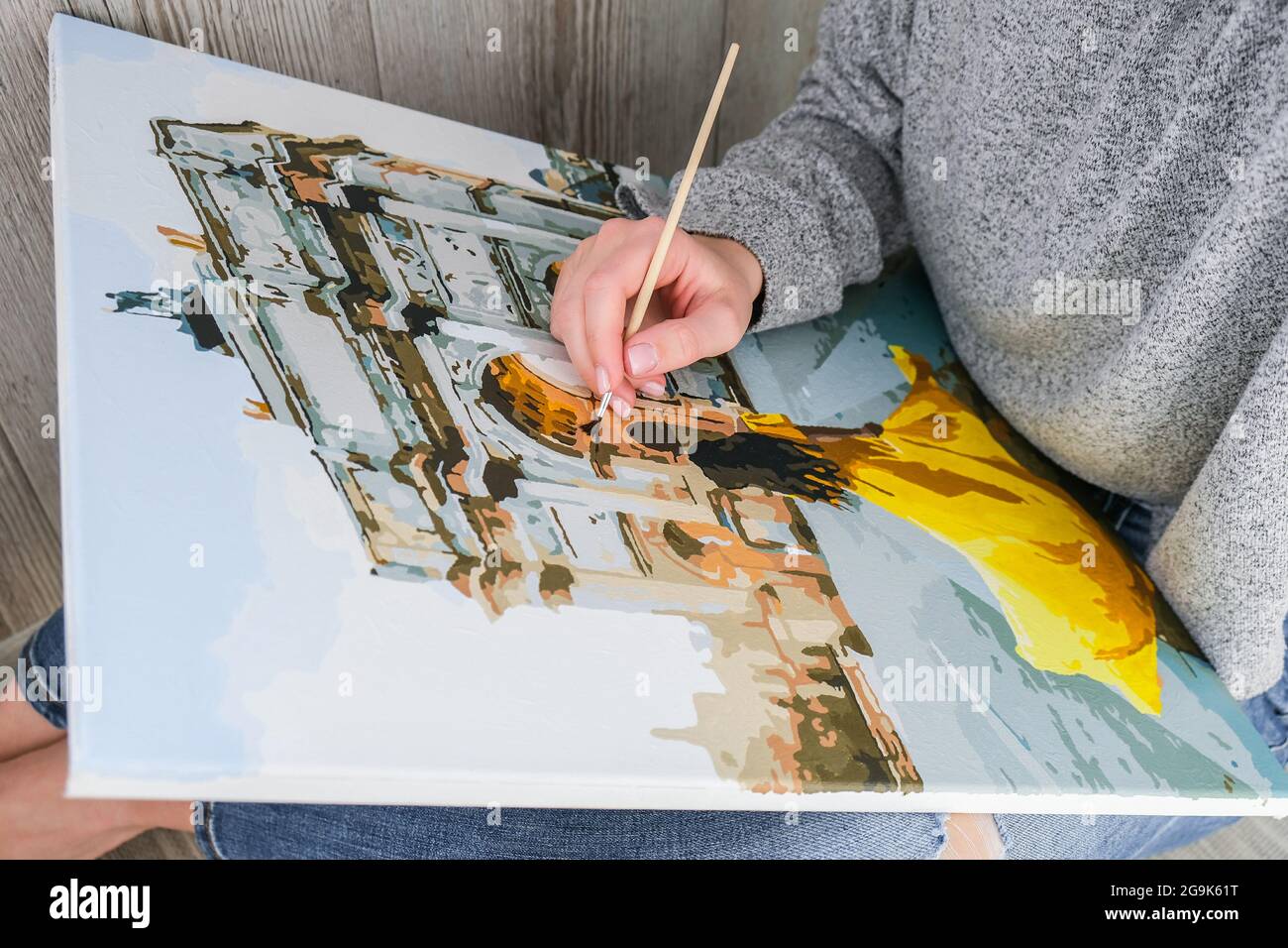 Female hands coloring canvas Picture by numbers girl Triumphal Arch ...