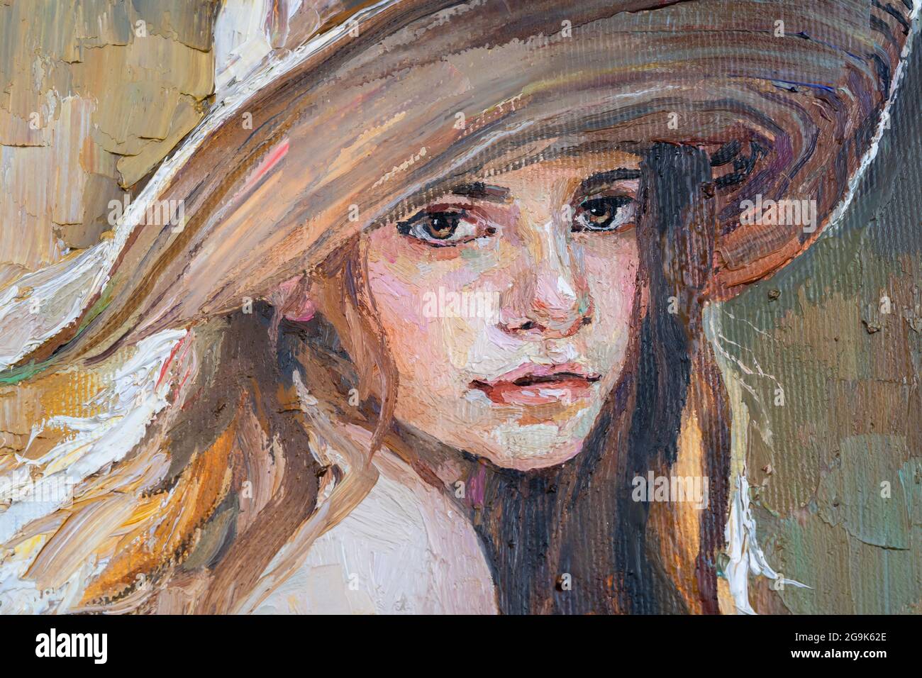 .A woman in a straw hat sits in the sunset Stock Photo - Alamy