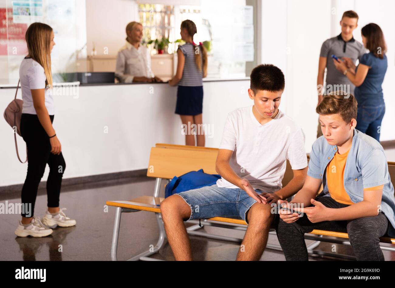 School Boys using phones, have rest between lessons Stock Photo - Alamy