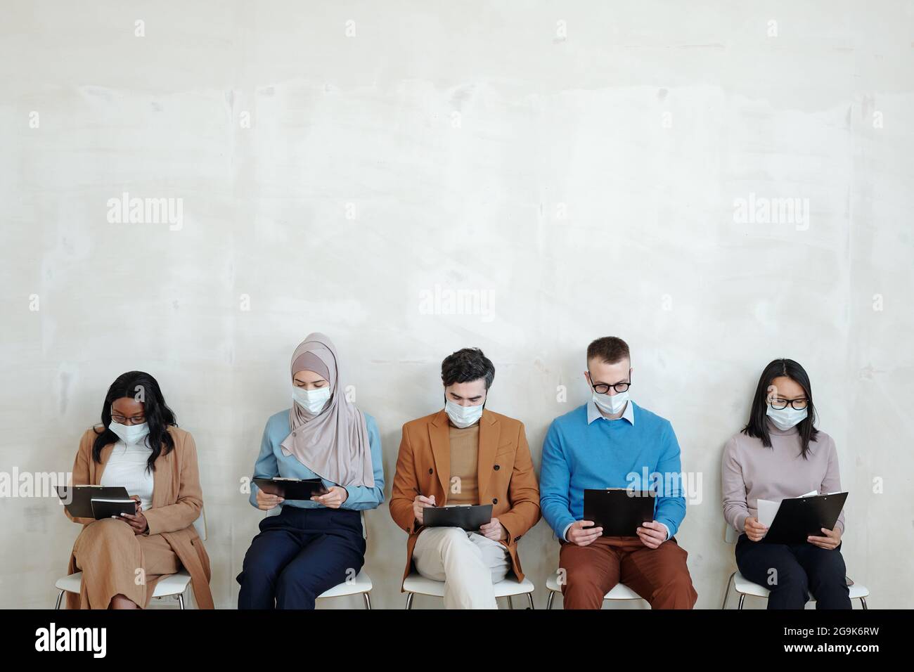 Young multiracial applicants waiting for their turn for interview ...