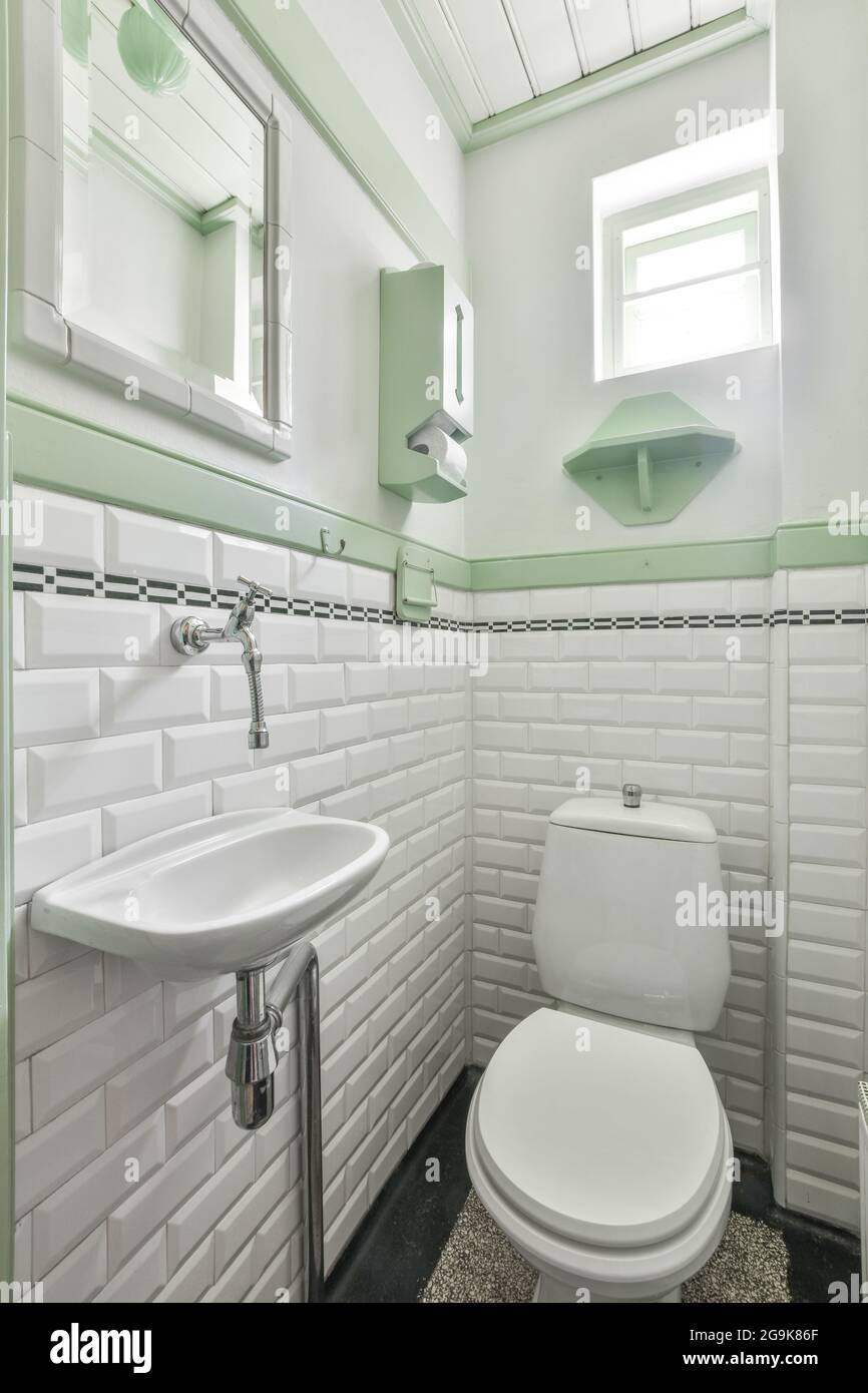 Interior of small clean washroom in miniature style Stock Photo - Alamy