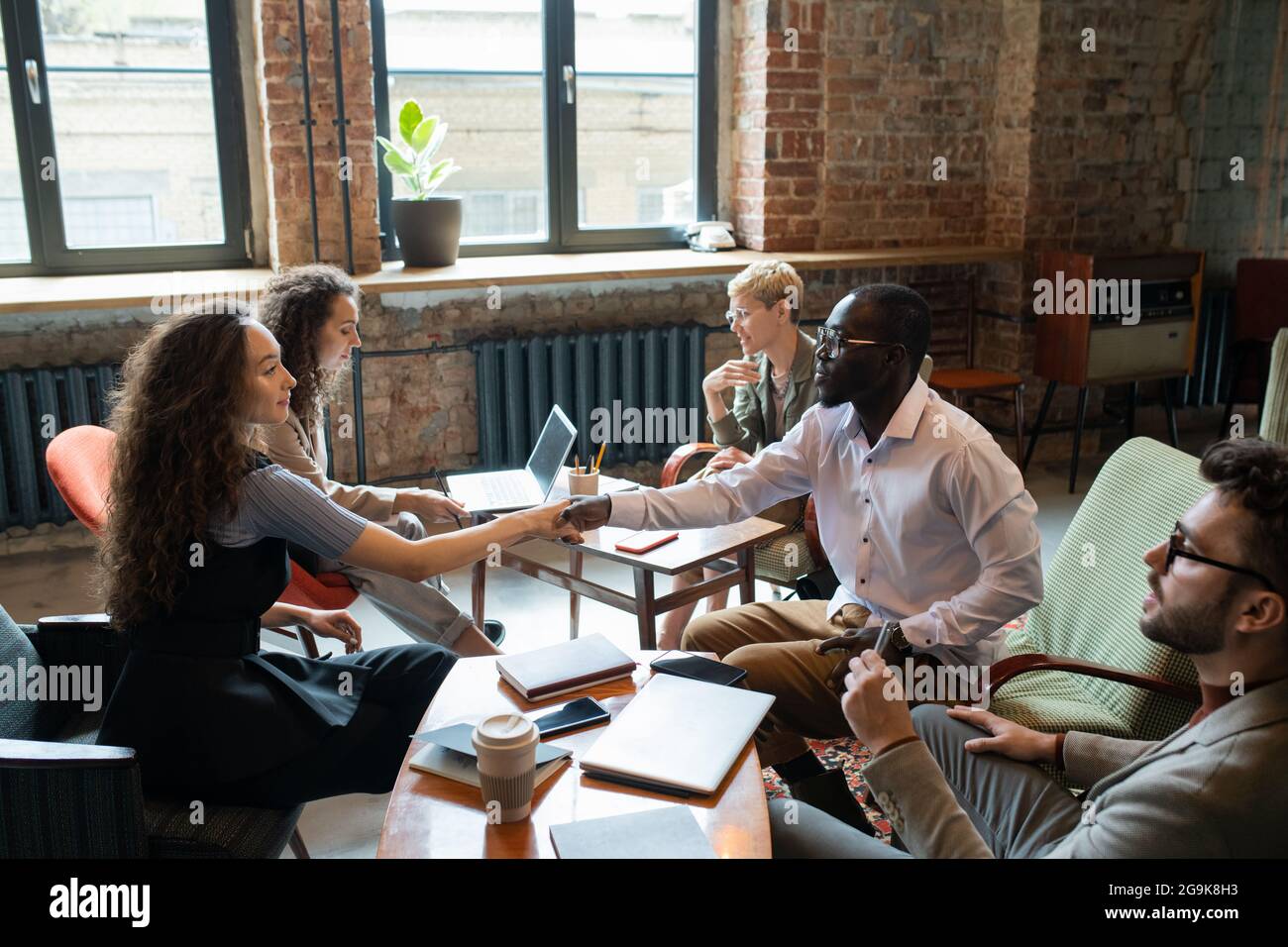 Young female colleague hi-res stock photography and images - Alamy