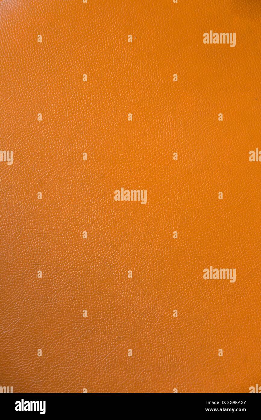 Orange color leather texture background Stock Photo - Alamy
