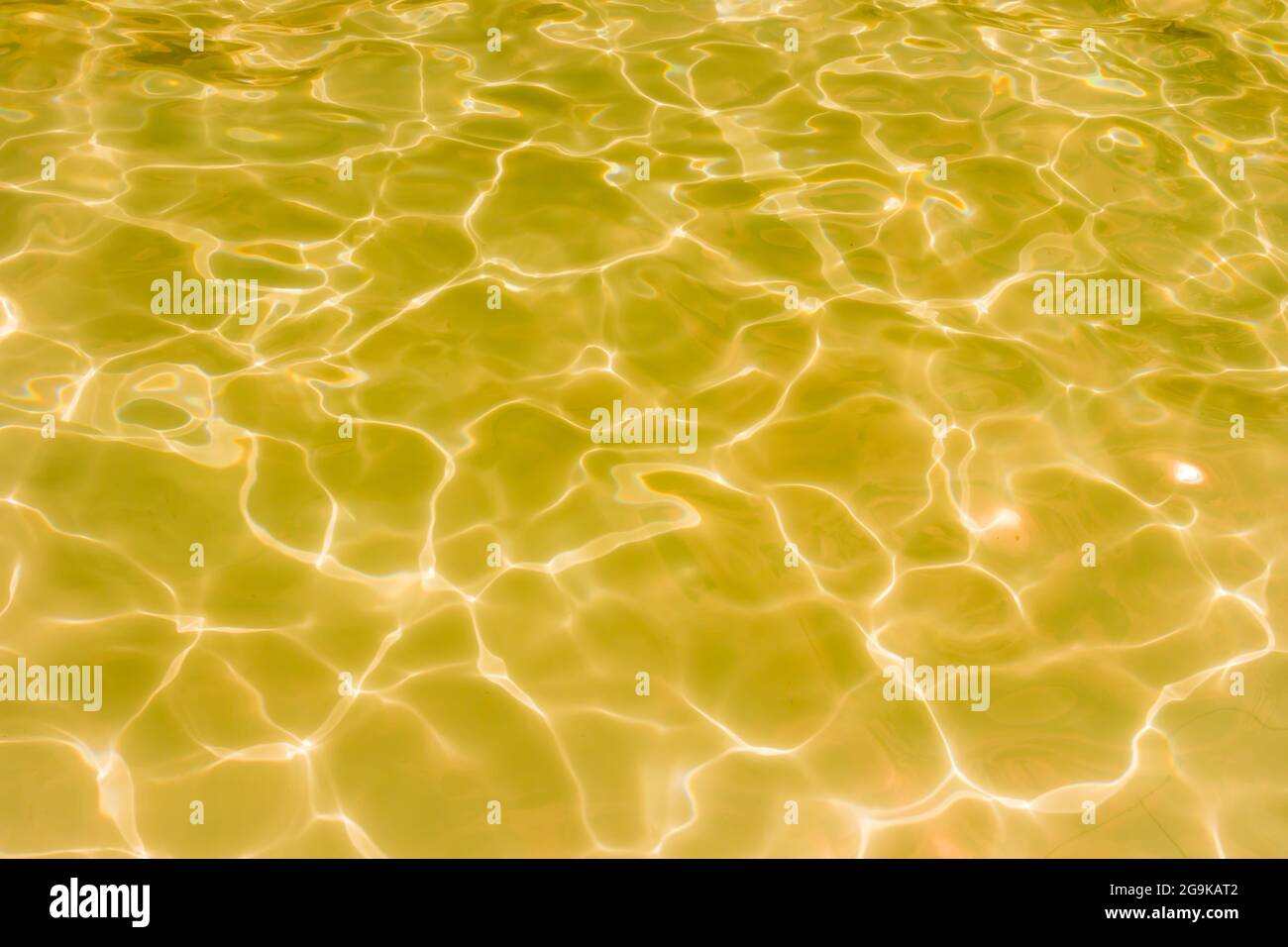 Gold swimming pool rippled water texture reflection Stock Photo - Alamy