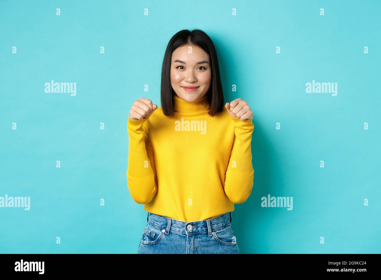 Beauty and fashion concept. Beautiful and stylish asian woman in yellow ...