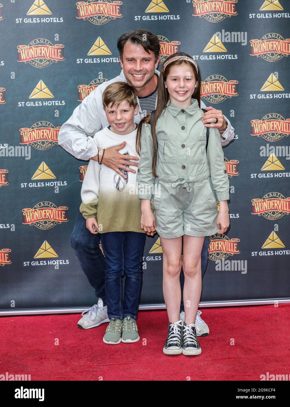 London, UK. 26th July, 2021. Neil McDermott and kids attend a gala ...