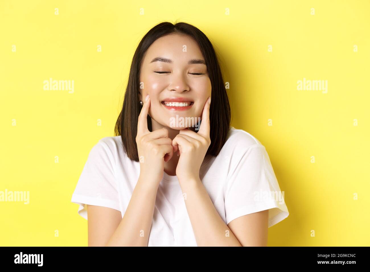 Beauty and skincare. Close up of young asian woman with short dark hair ...