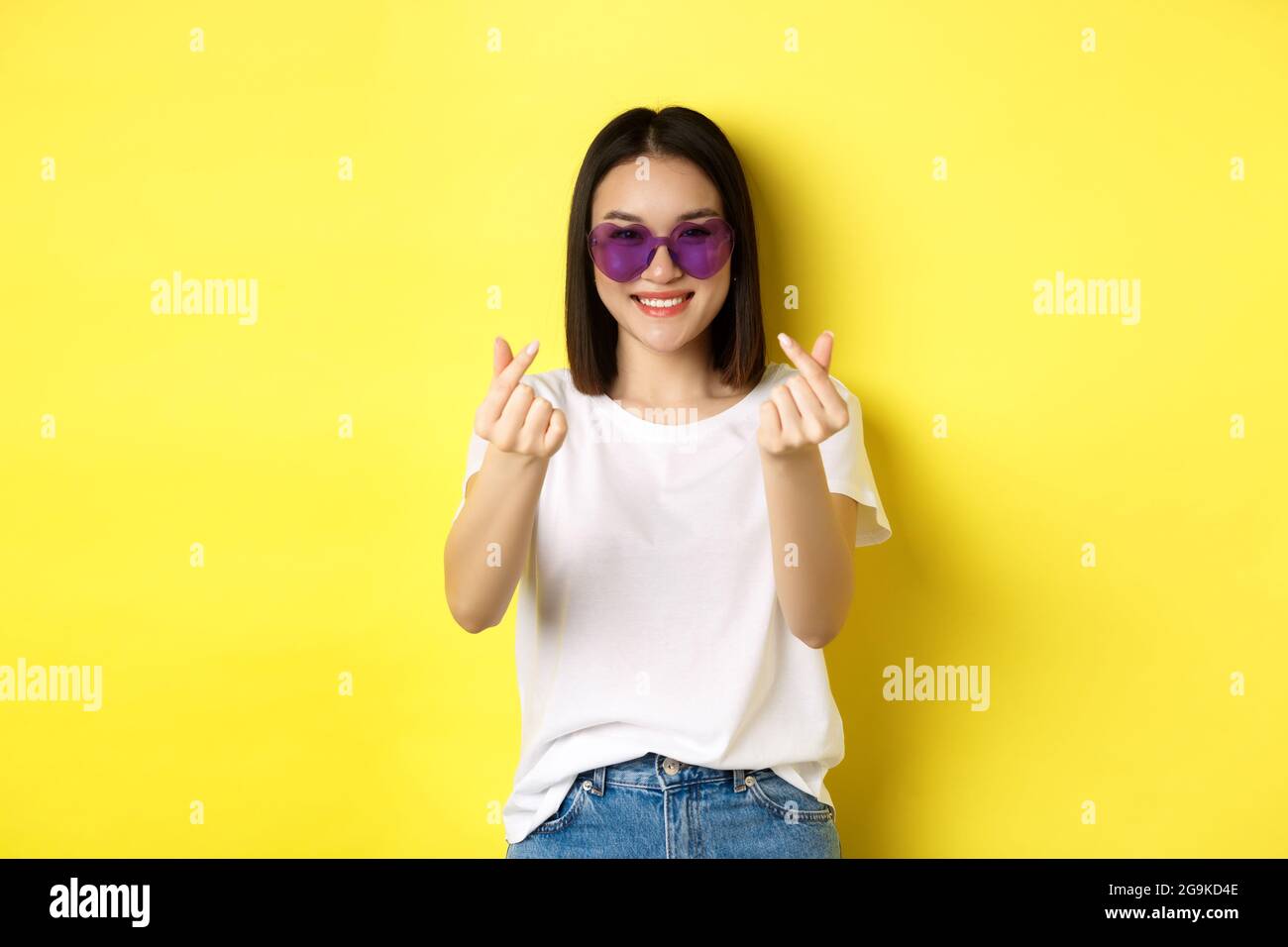 Fashion and lifestyle concept. Attractive asian woman in heart-shape ...