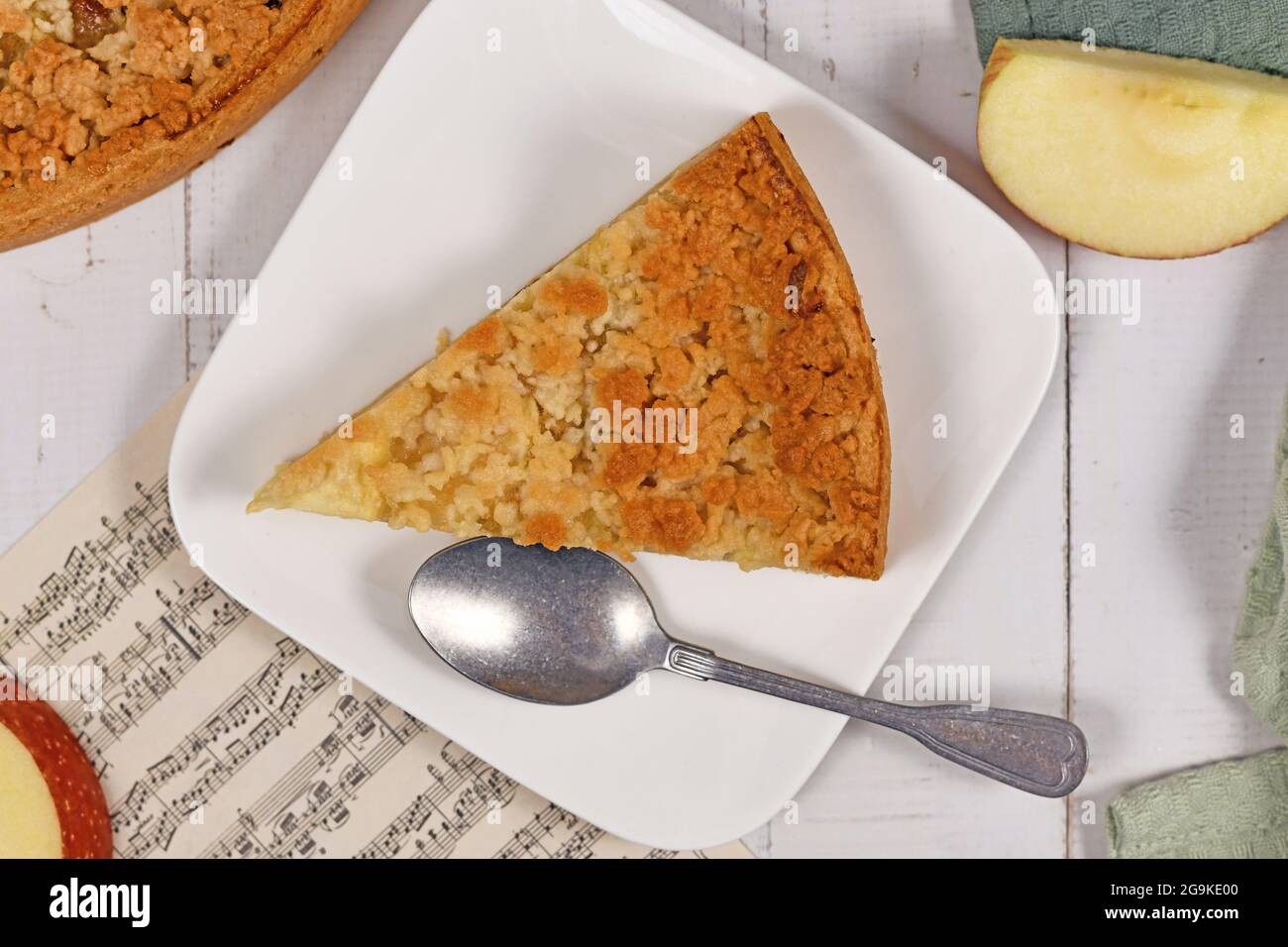 Slice of traditional European apple pie with topping crumbles called ...