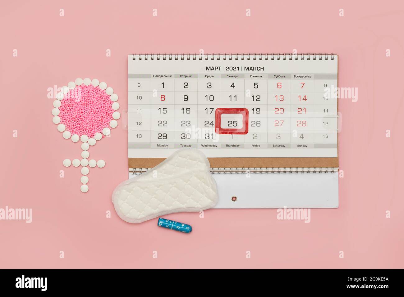 Female's symbol made of tablets and menstrual calendar. Female period ...