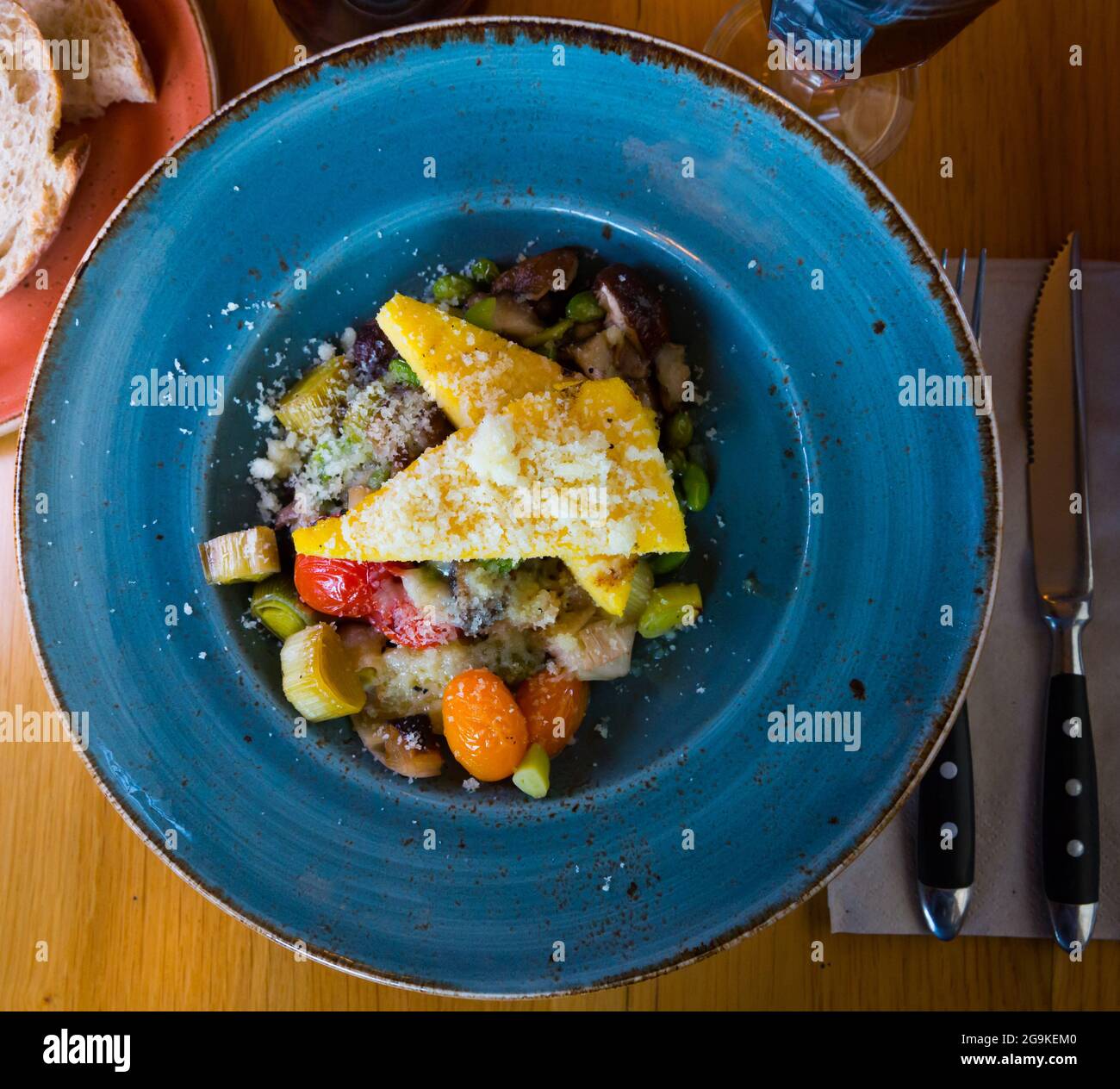 Mushrooms with baked vegetables under cheese Stock Photo - Alamy