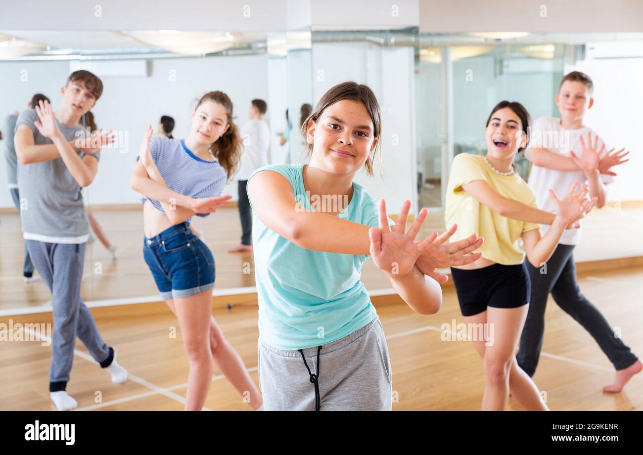 Teenage girl exercising during group dance class Stock Photo - Alamy