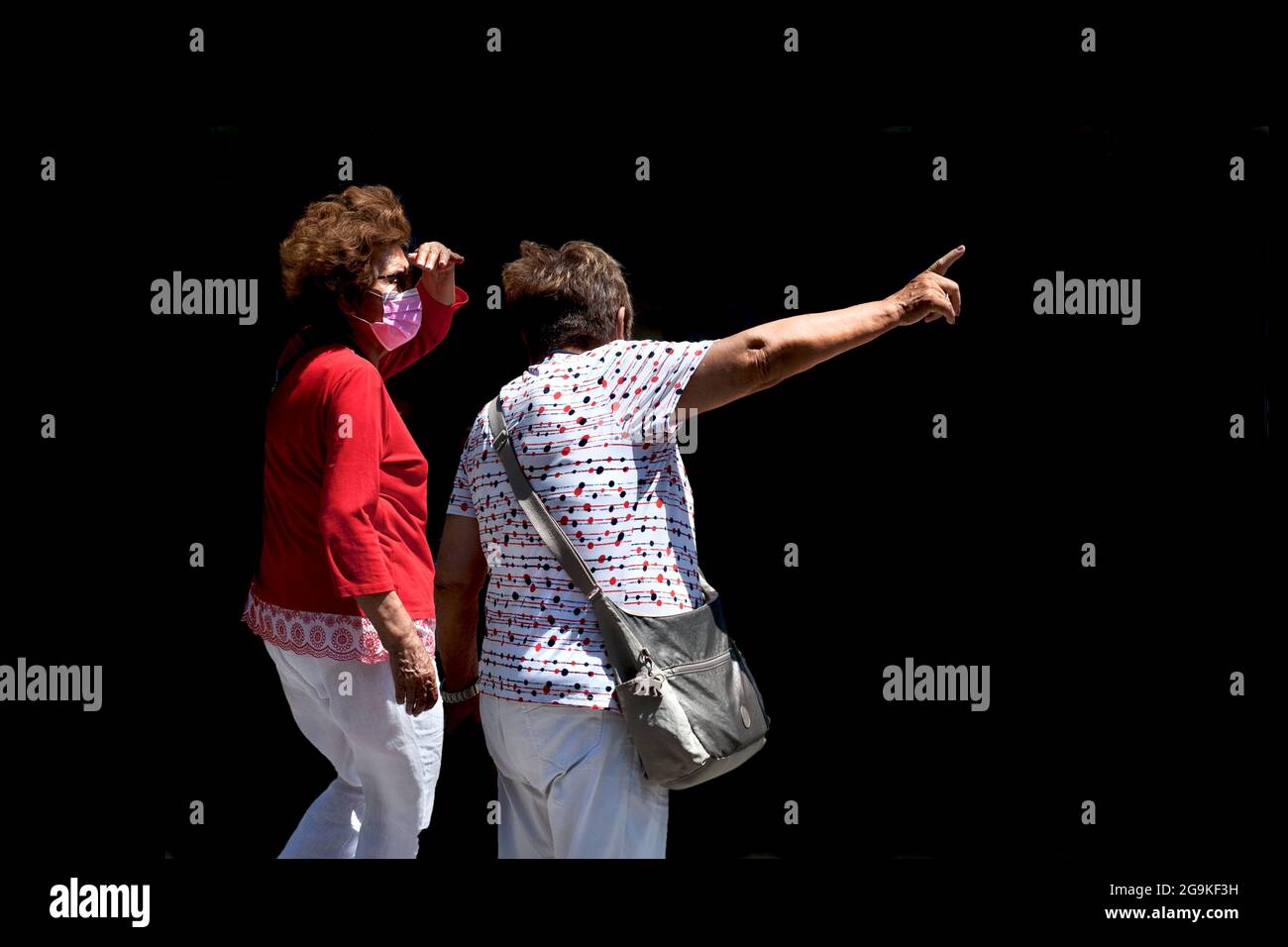 Two women pointing hi-res stock photography and images - Alamy