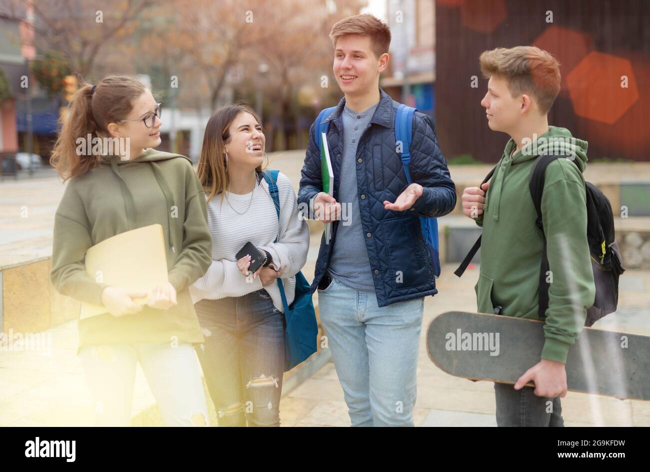 Teenage students talking outside after lessons Stock Photo - Alamy