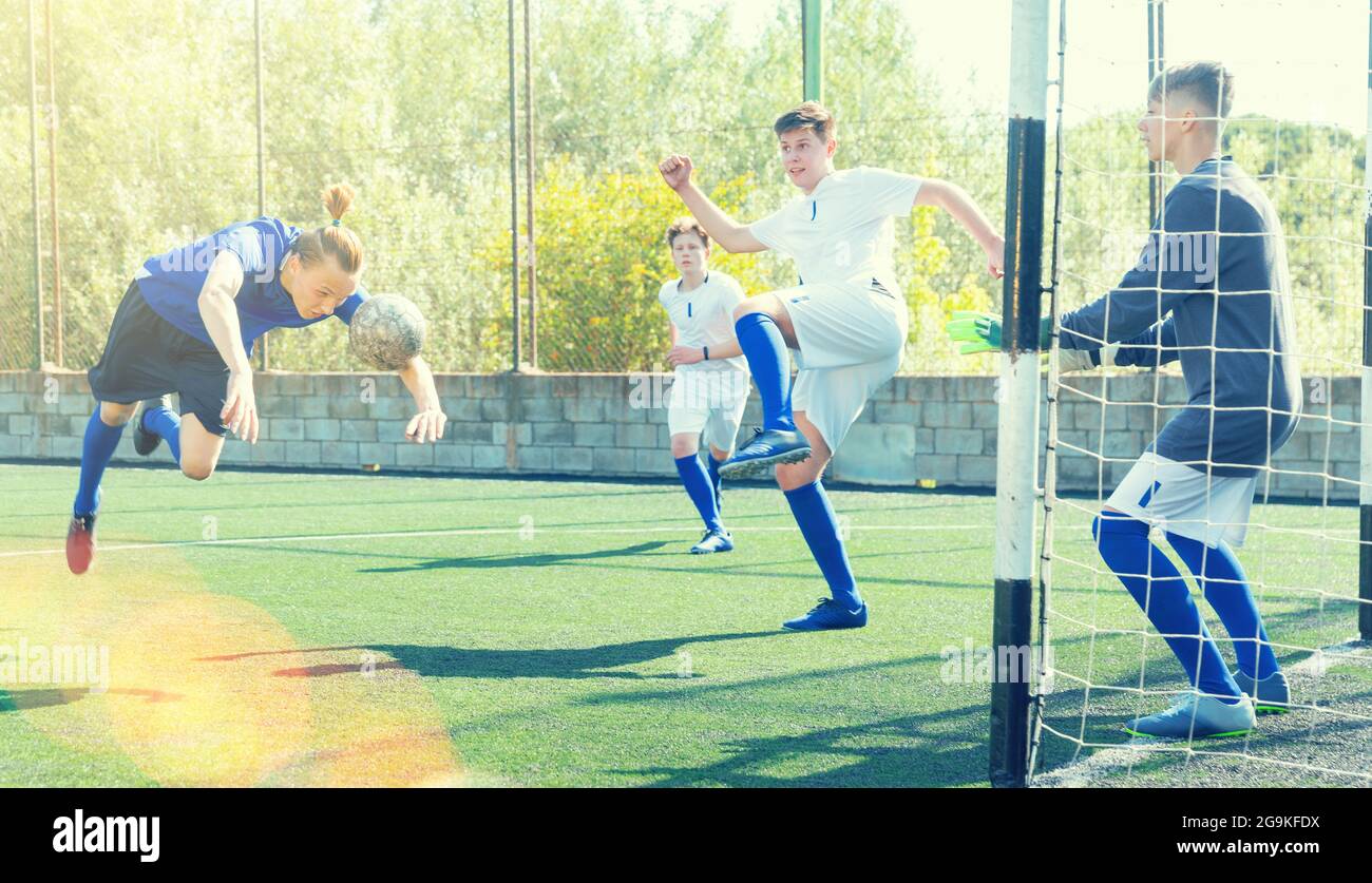 Football header boy hi-res stock photography and images - Alamy