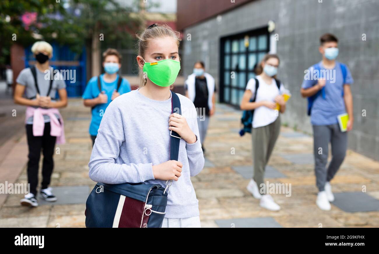 Teenage girl in protective mask going to school lessons Stock Photo - Alamy