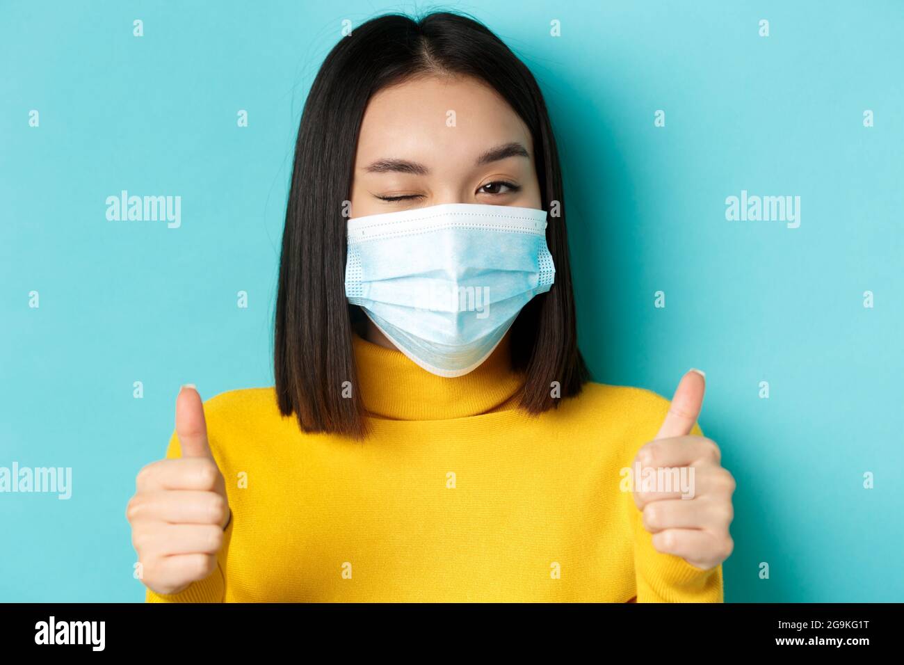 Covid-19, social distancing and pandemic concept. Cute asian girl in ...