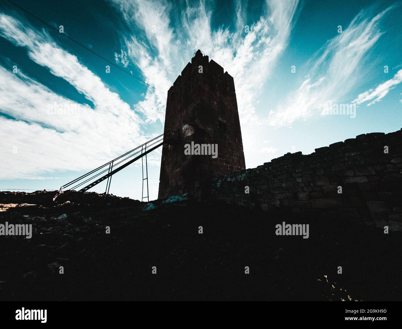 Low angle shot of an old stout tower from a medieval castle under a ...