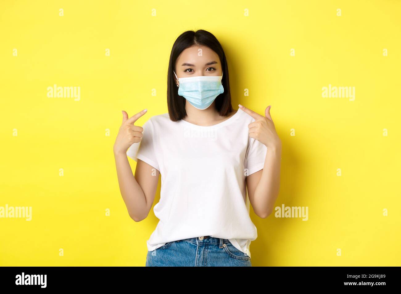 Covid-19, quarantine and social distancing concept. Young asian woman ...