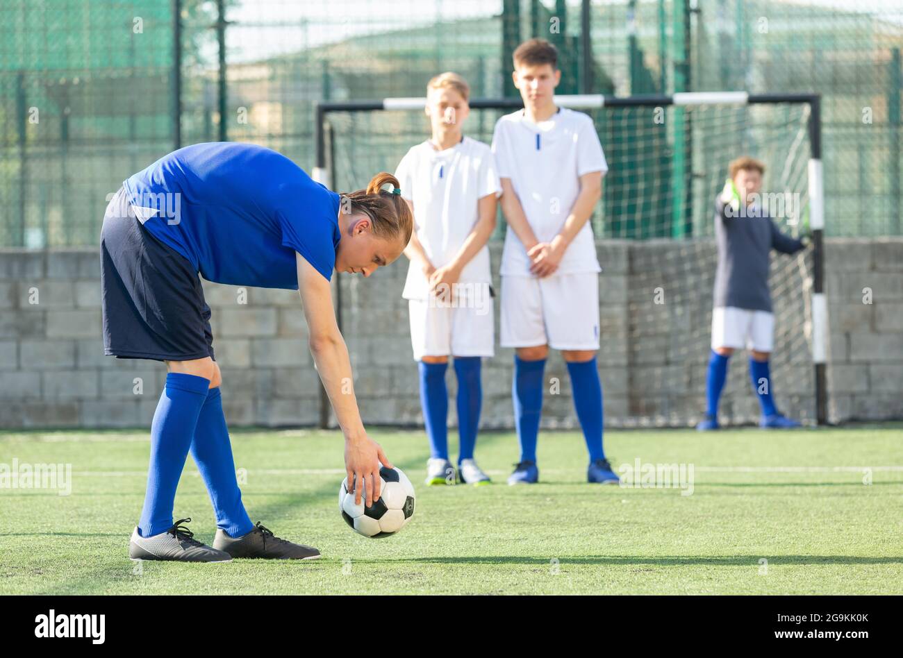 Two youth teams play football Stock Photo - Alamy