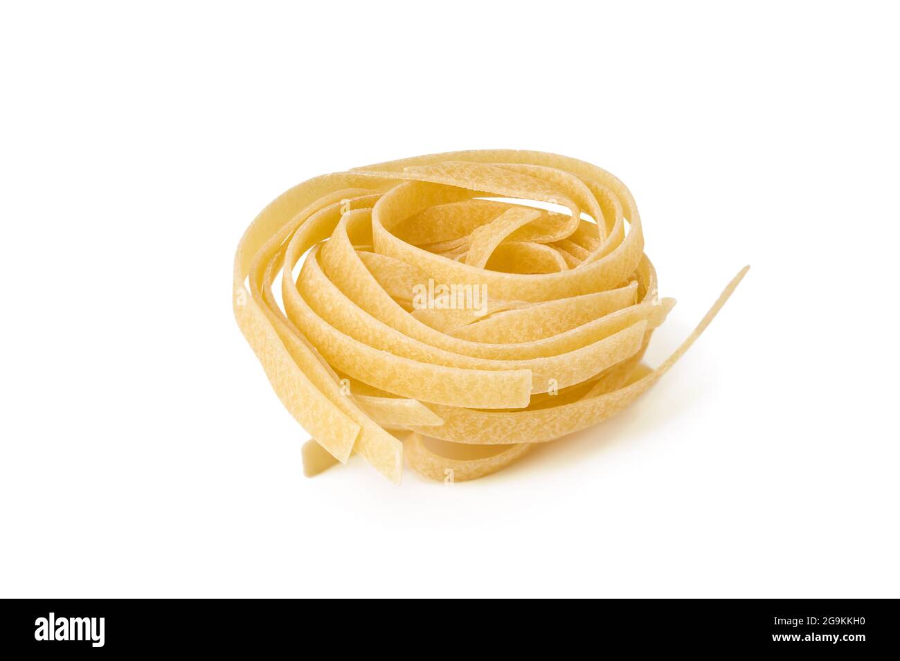 Uncooked nest of tagliatelle pasta isolated on white background Stock ...