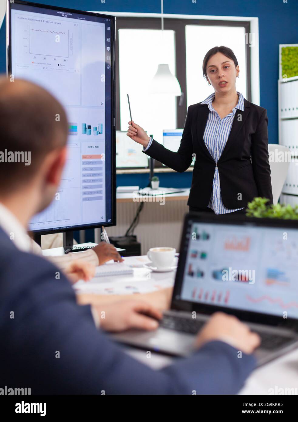 Startup female entrepreneur in business meeting with team, working in ...