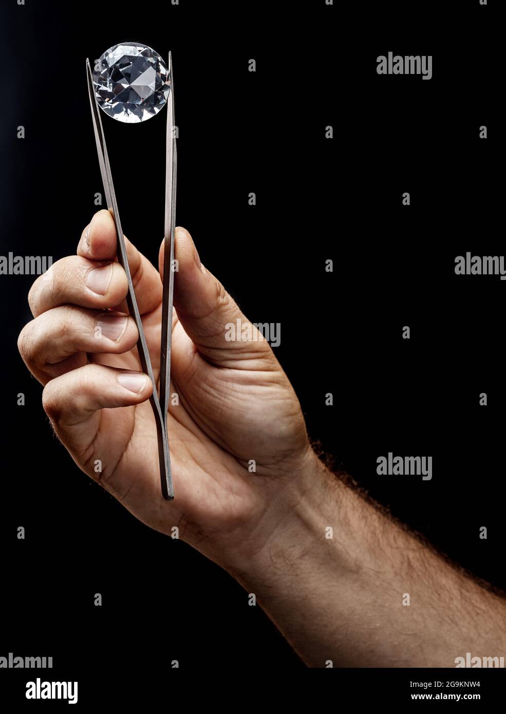 Large gemstone in jeweler's hand close up. Gem identifying and ...