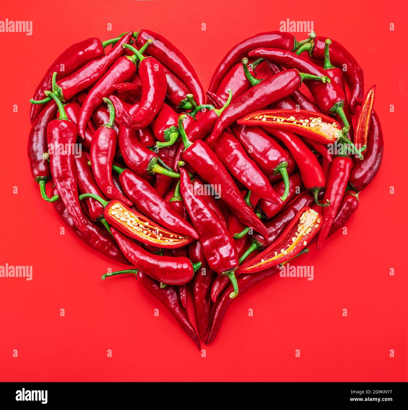 Fresh red chilli pepper in the shape of heart isolated on white ...