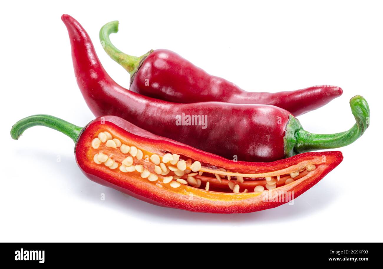 Fresh red chilli pepper and cross sections of chilli pepper with seeds ...