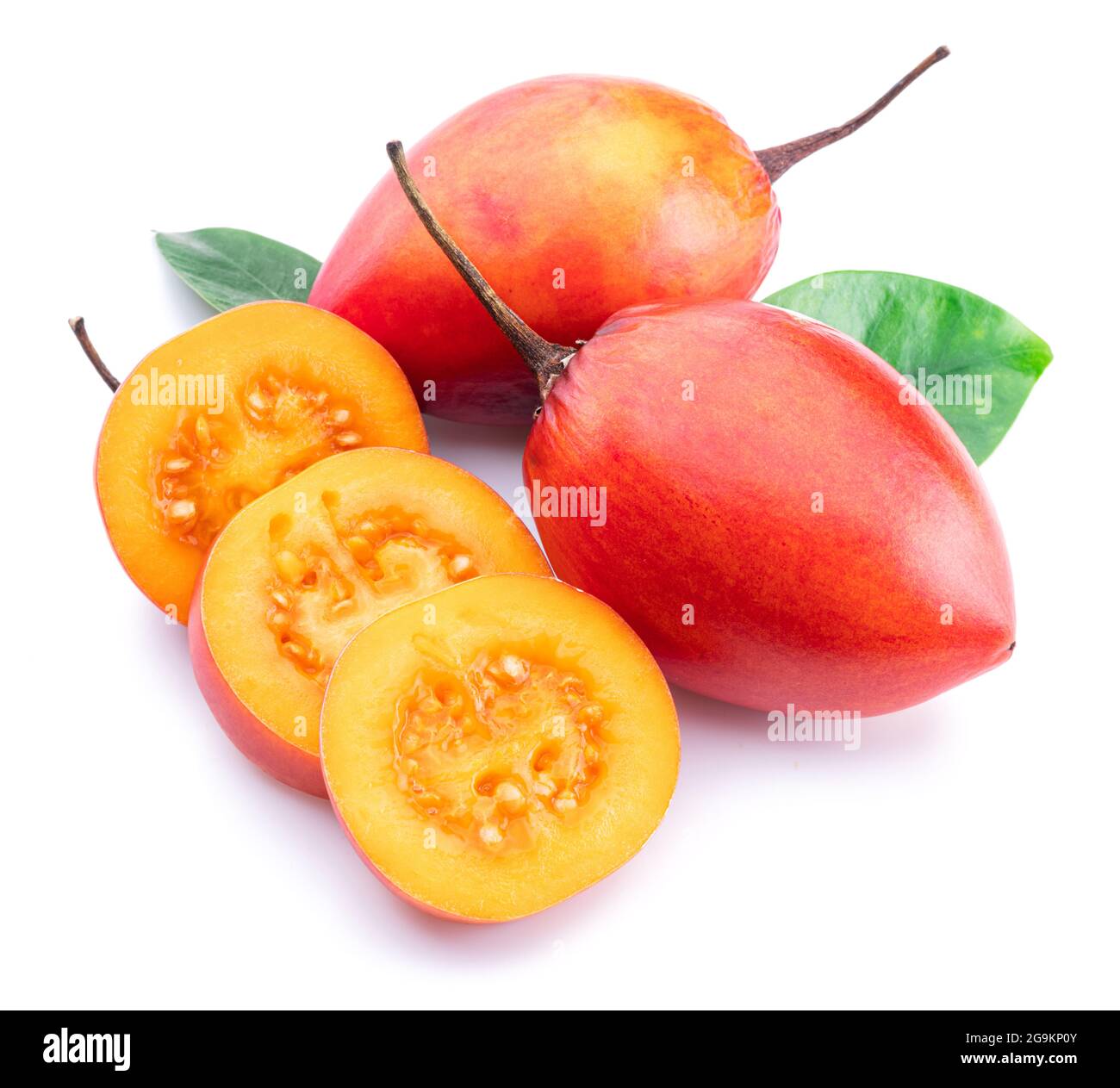 Ripe tamarillo fruits with slices and tamarillo leaves isolated on a ...