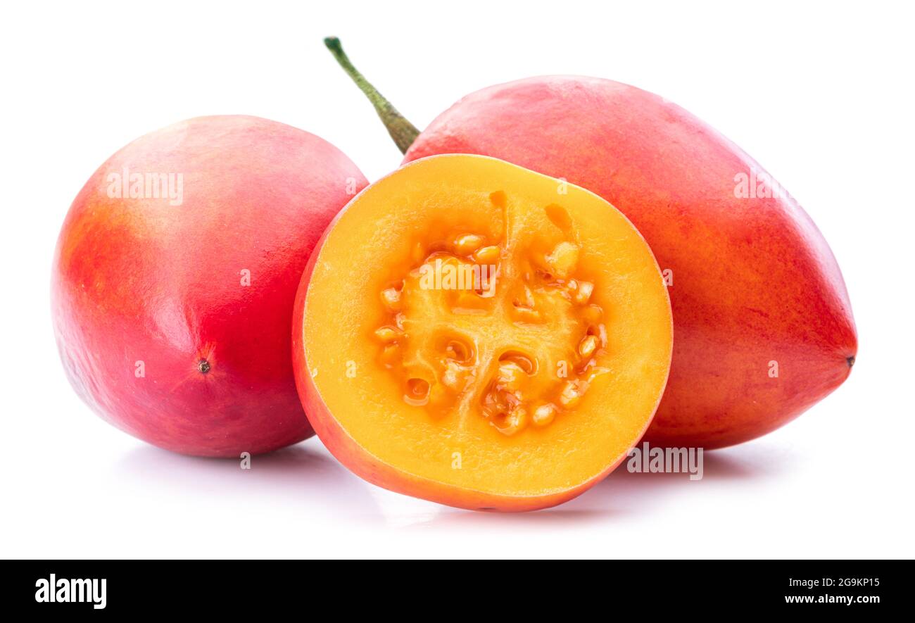Ripe tamarillo fruits with tamarillo slices isolated on a white ...