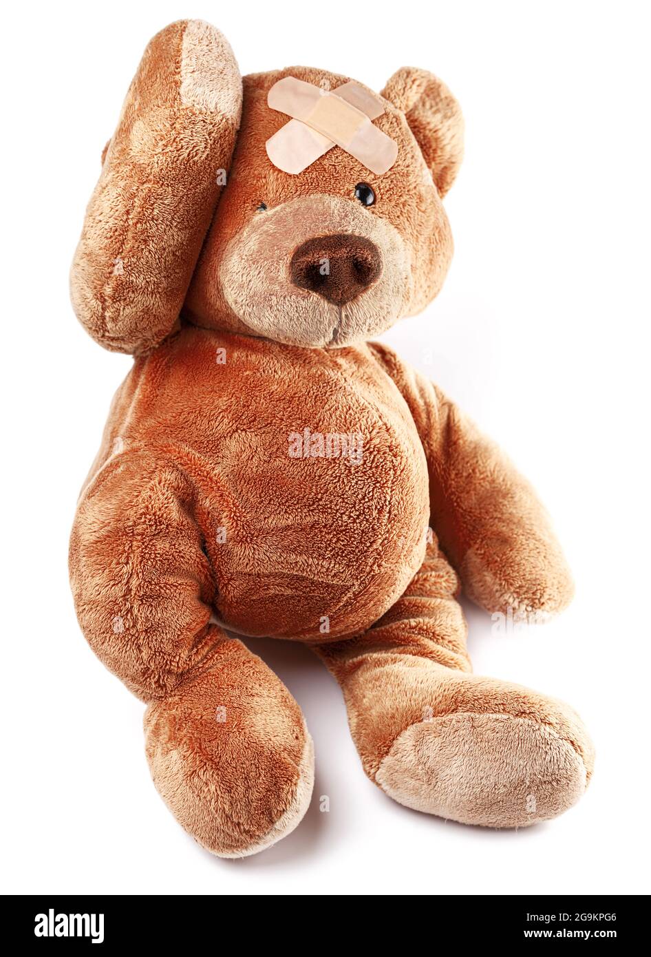 Teddy bear with bandage on the forehead isolated on white background ...