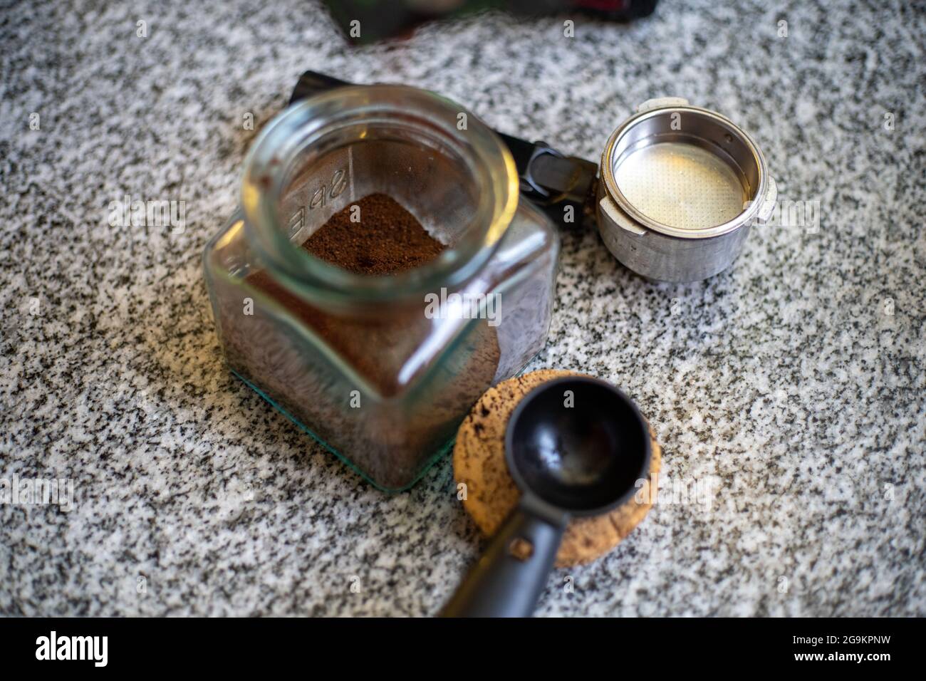 Ground coffee in a jar next to the tools for making coffee Stock Photo ...