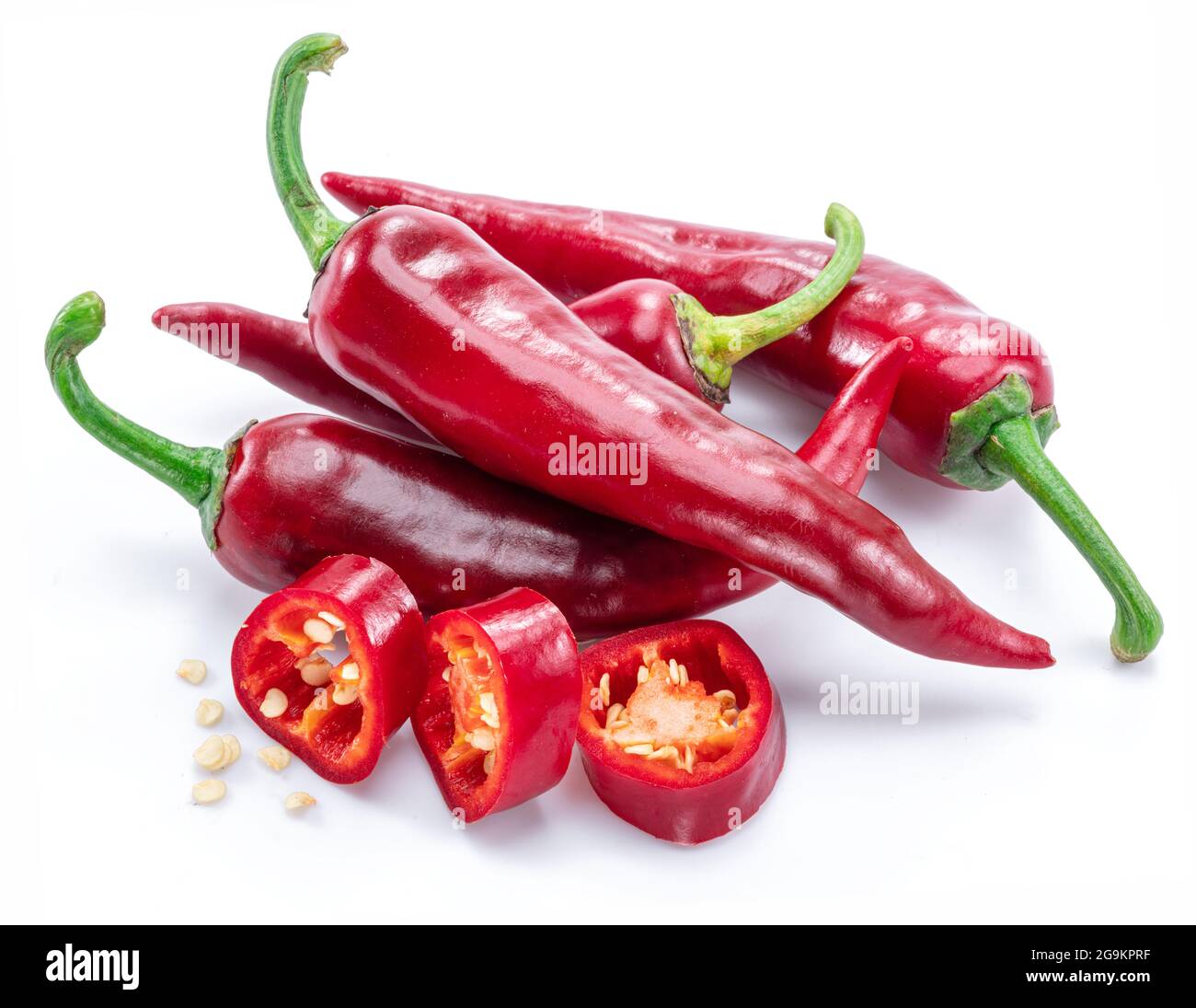 Fresh red chilli pepper and cross sections of chilli pepper with seeds ...