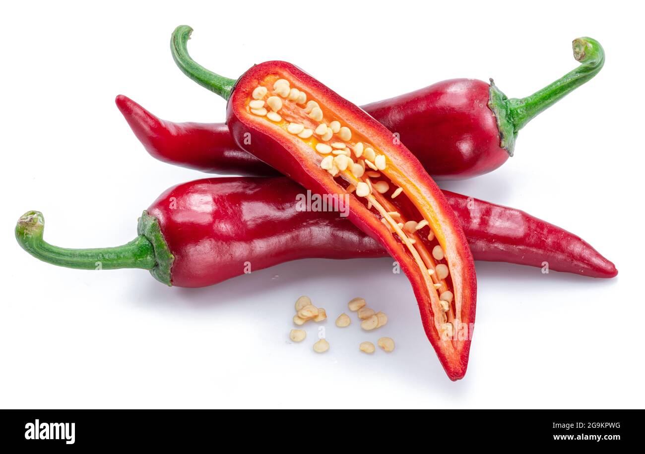 Fresh red chilli peppers and cross section of chilli pepper with seeds ...