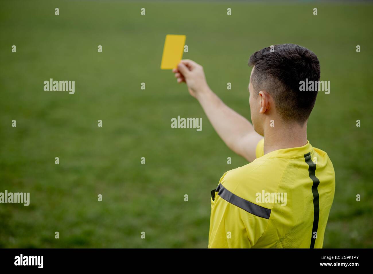 Referee showing a red card to a displeased football or soccer player ...