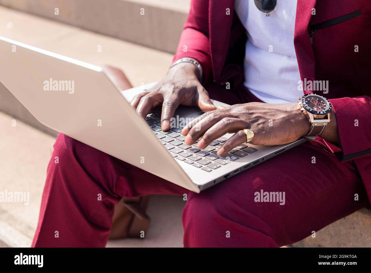 detail of the hands of an unrecognizable black man working with his ...