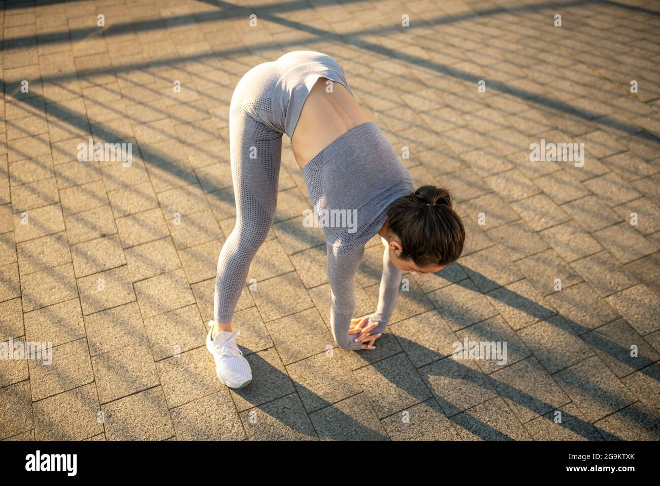 Young female sportsperson doing sports outside Stock Photo - Alamy