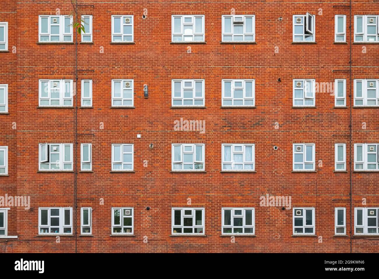 Facade of a red brick mansion block around Hackney in London Stock ...