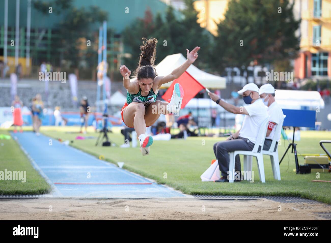 ISTANBUL, TURKEY - JUNE 13, 2021: Undefined athlete long jumping during ...