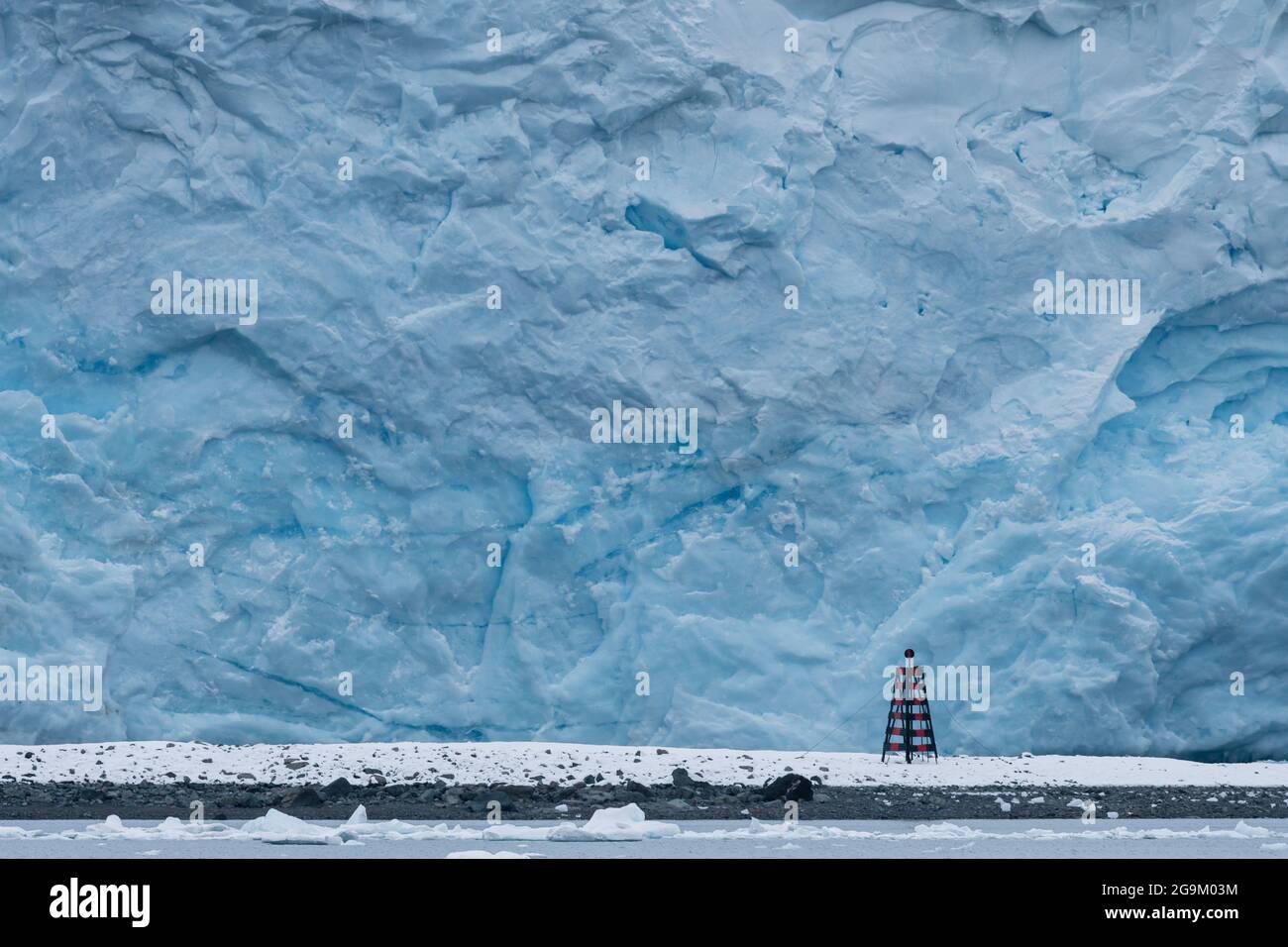 A huge wall of ice rising up from the ocean near Graham Land ...