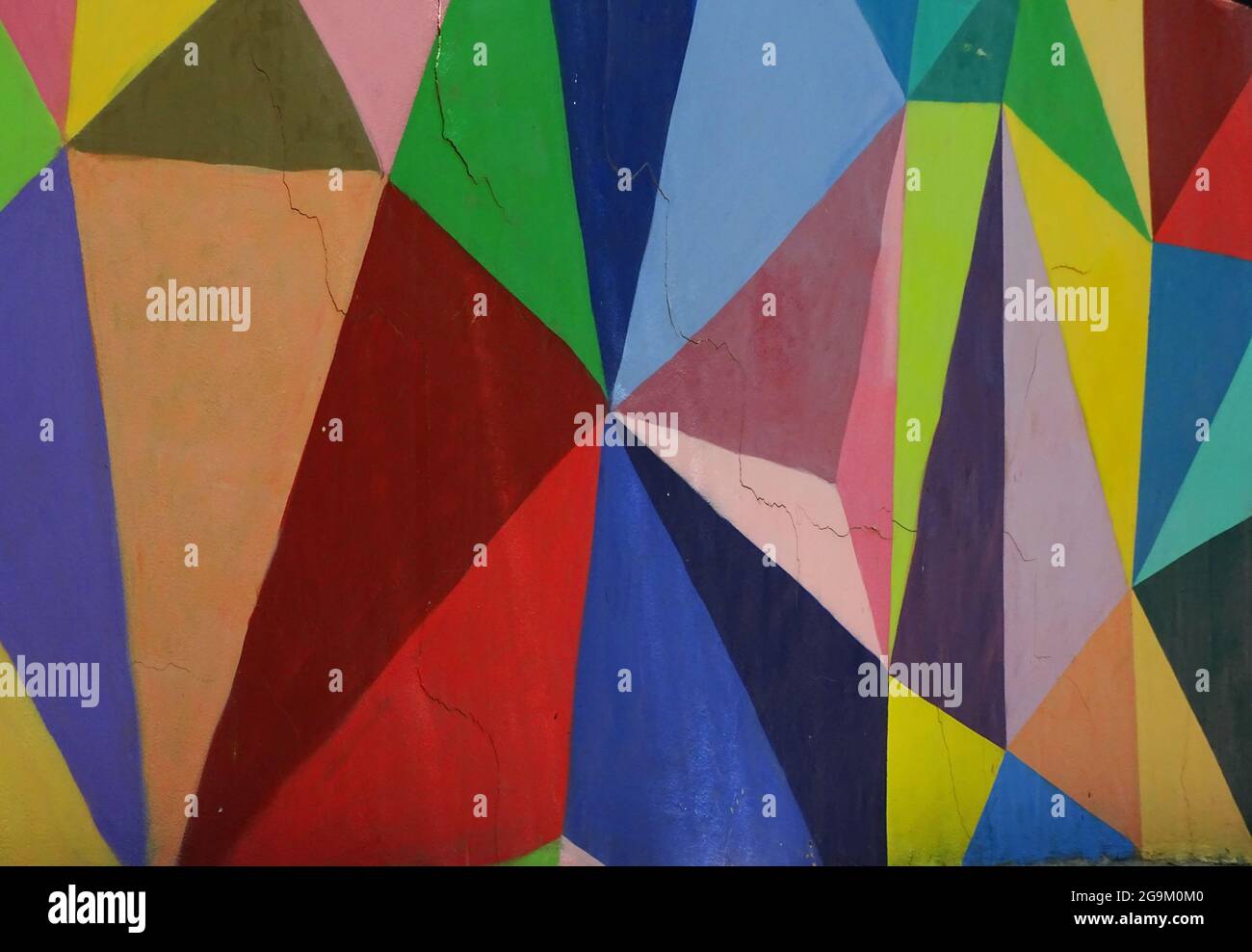 Wall texture made of triangles of different colors Stock Photo - Alamy
