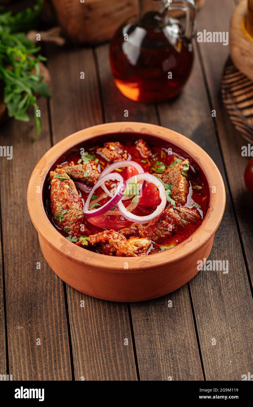 Georgian dish chakhokhbili stewed chicken Stock Photo - Alamy