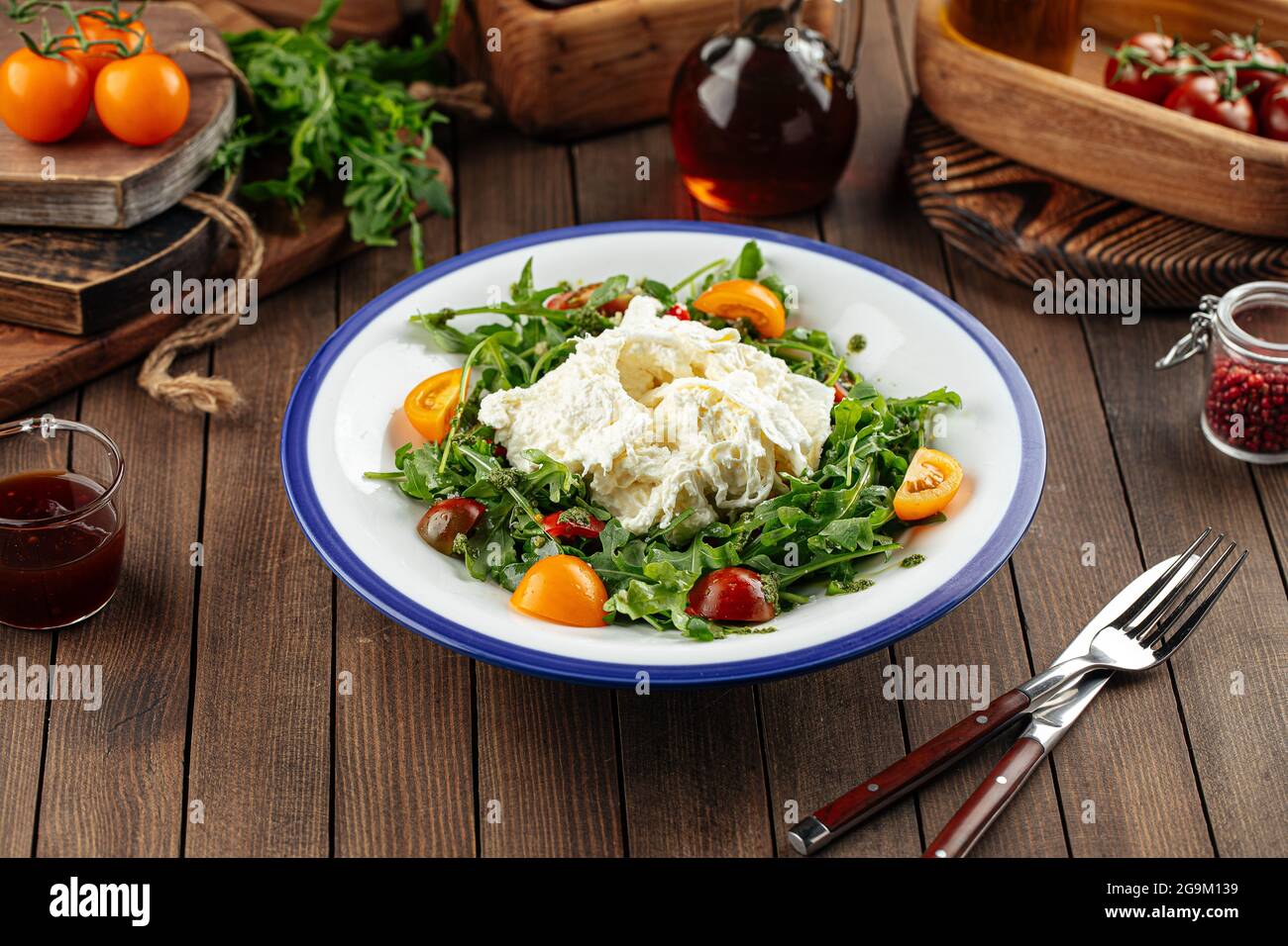 Burrata cheese arugula salad Stock Photo - Alamy