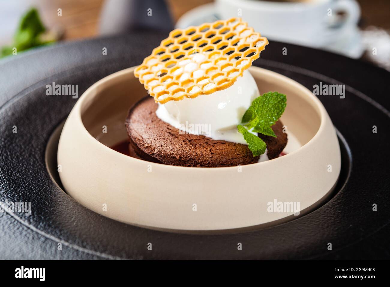 Chocolate fondant. Dark chocolate, raspberry sauce, vanilla ice cream ...
