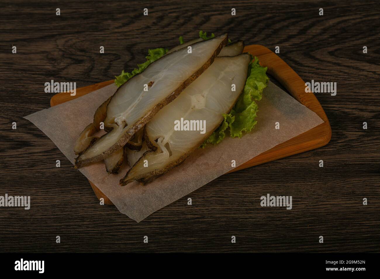 Delicous smoked halibut fish slices snack Stock Photo - Alamy