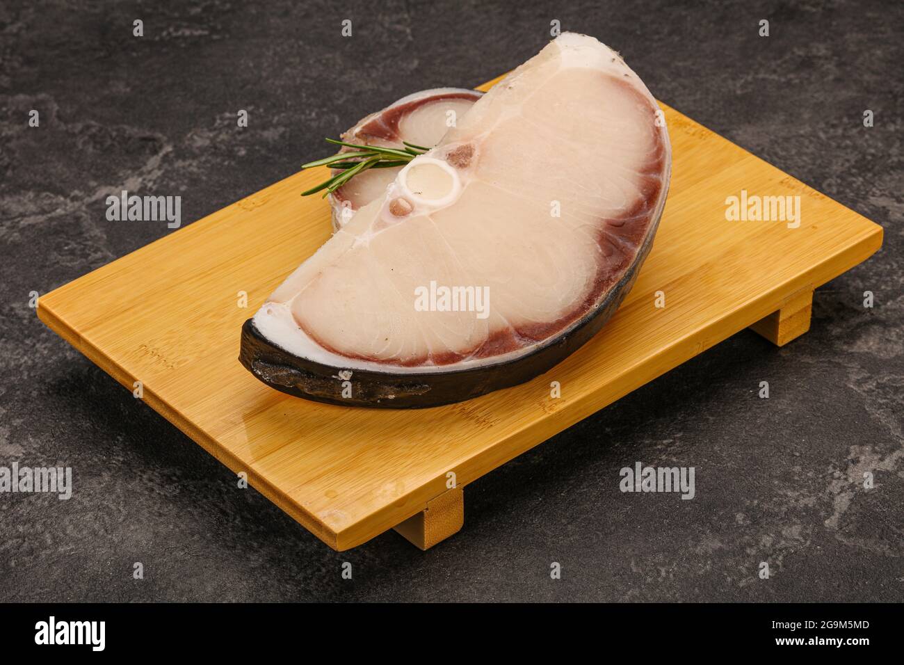 Raw shark steak served rosemary for cooking Stock Photo - Alamy