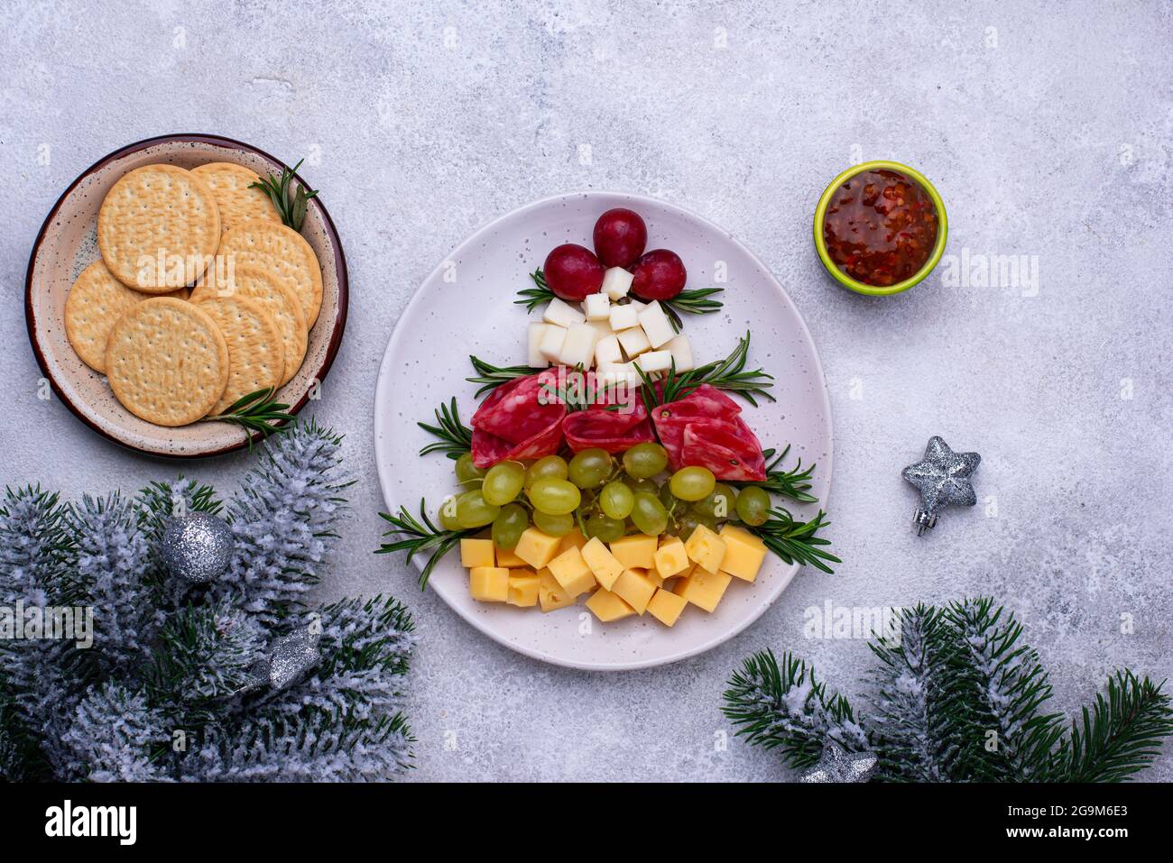 Cheese plate with salami in shape of tree Stock Photo - Alamy