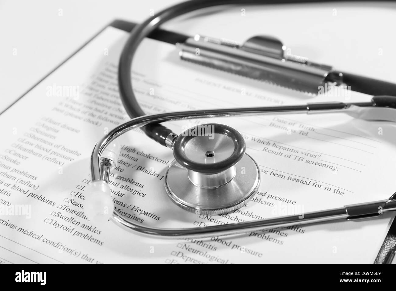 Medical history on clipboard with stethoscope on light background Stock ...